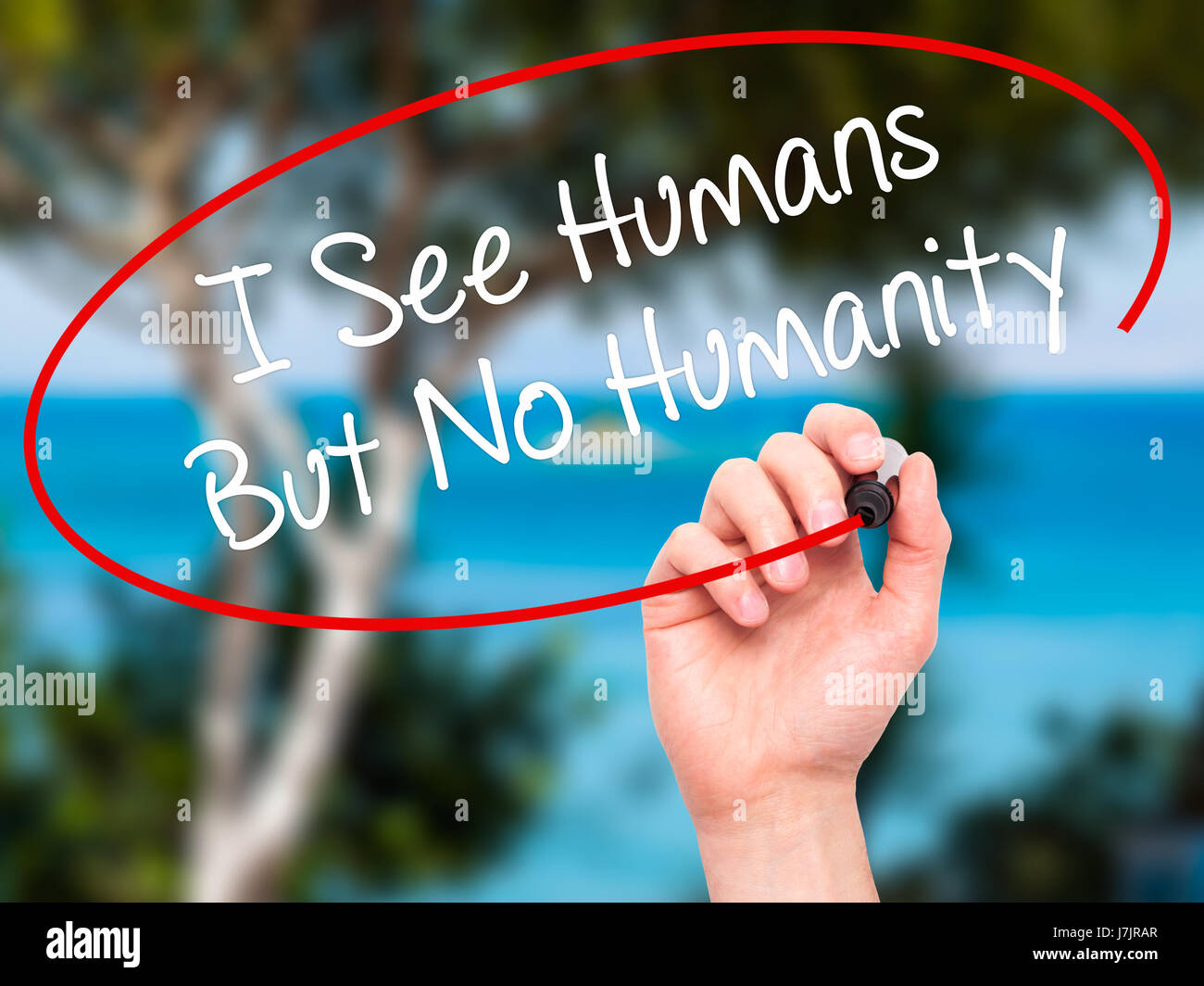 Man Hand writing I See Humans But No Humanity with black marker on ...