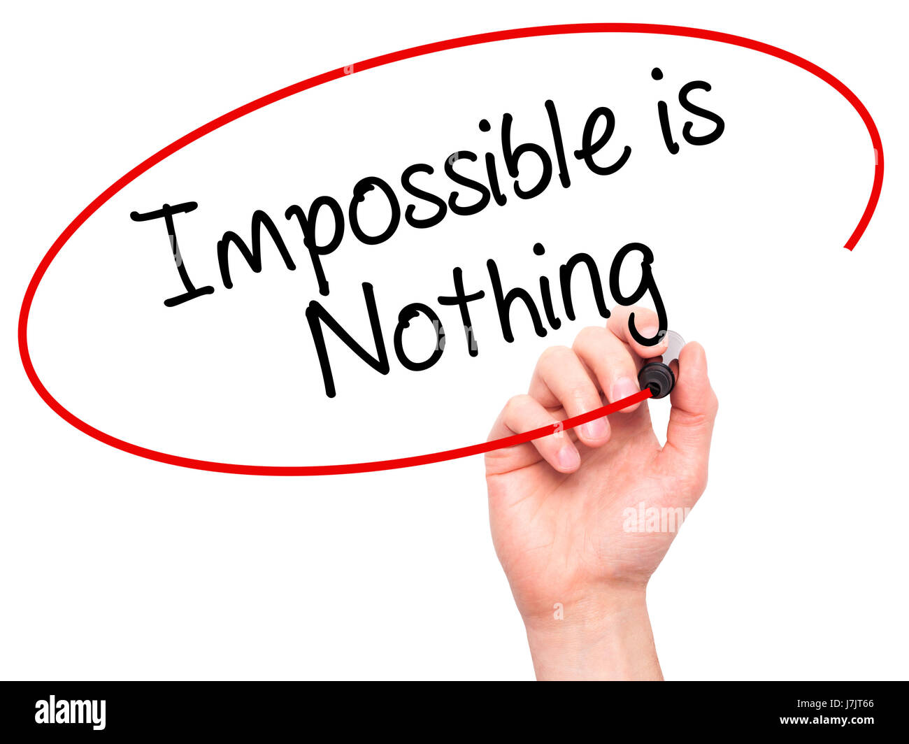 Man Hand writing Impossible is Nothing with black marker on visual ...