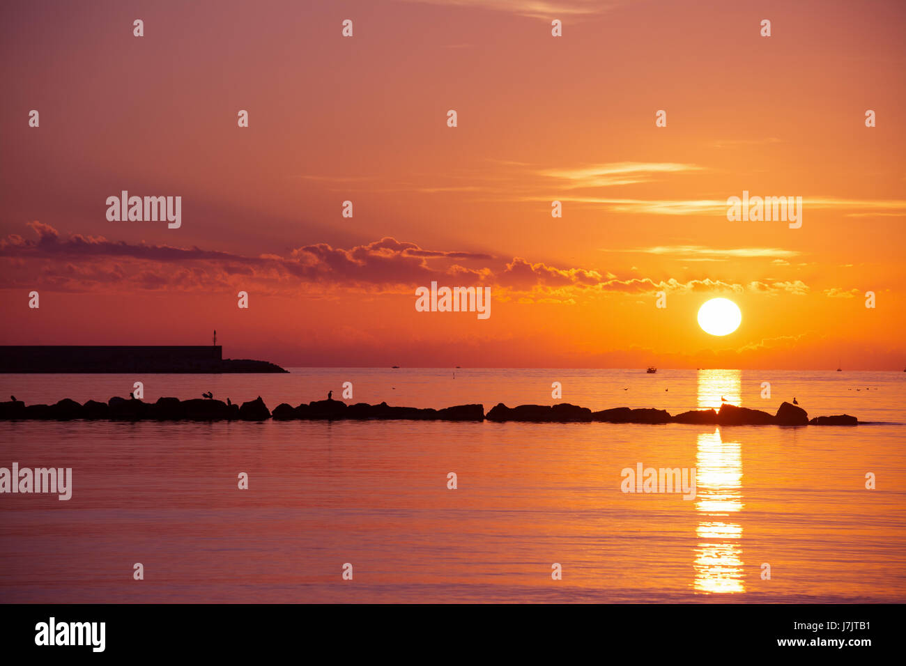 pink sunset in Alghero, Sardinia Stock Photo - Alamy