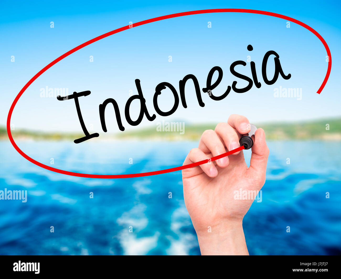 Man Hand writing Indonesia with black marker on visual screen. Isolated ...