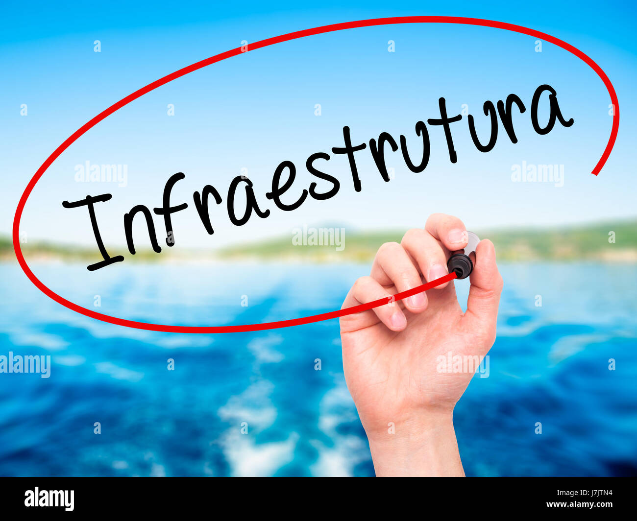 Man Hand writing Infraestrutura (Infrastructure in Portuguese) with ...