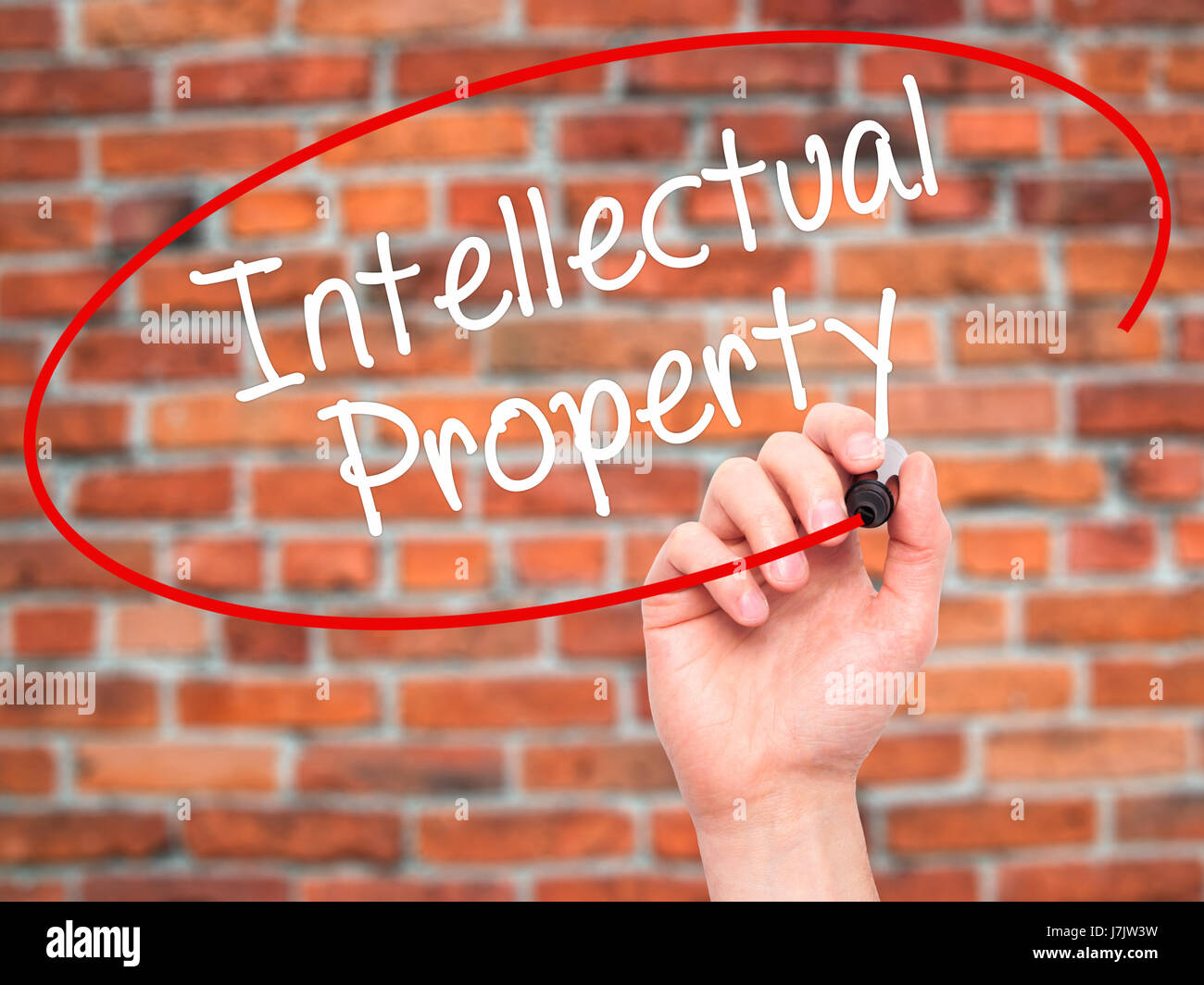 Man Hand writing Intellectual Property with black marker on visual ...