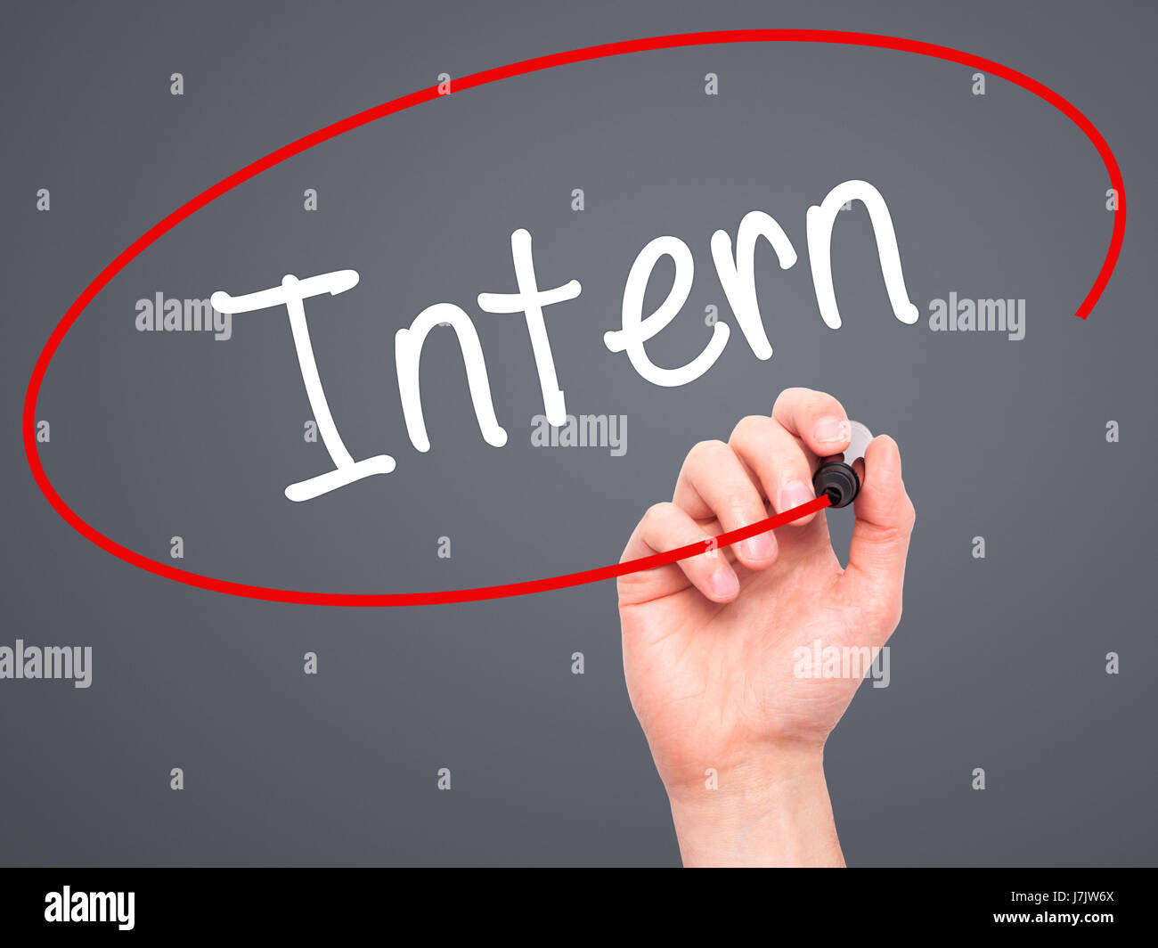 Man Hand writing Intern with black marker on visual screen. Isolated on ...