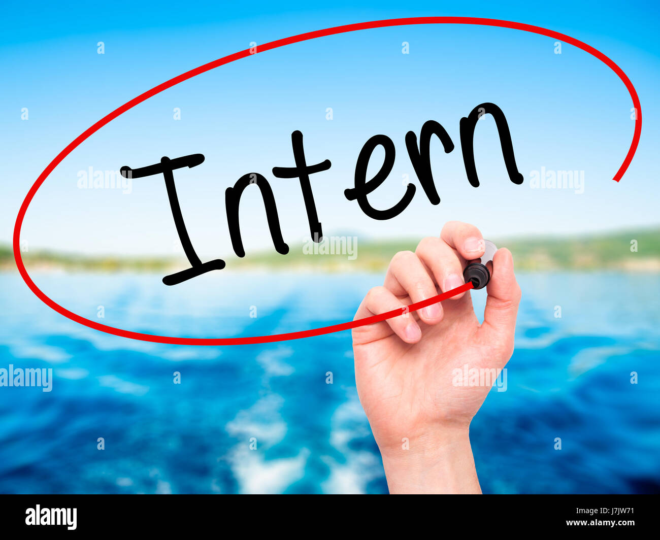 Man Hand writing Intern with black marker on visual screen. Isolated on ...