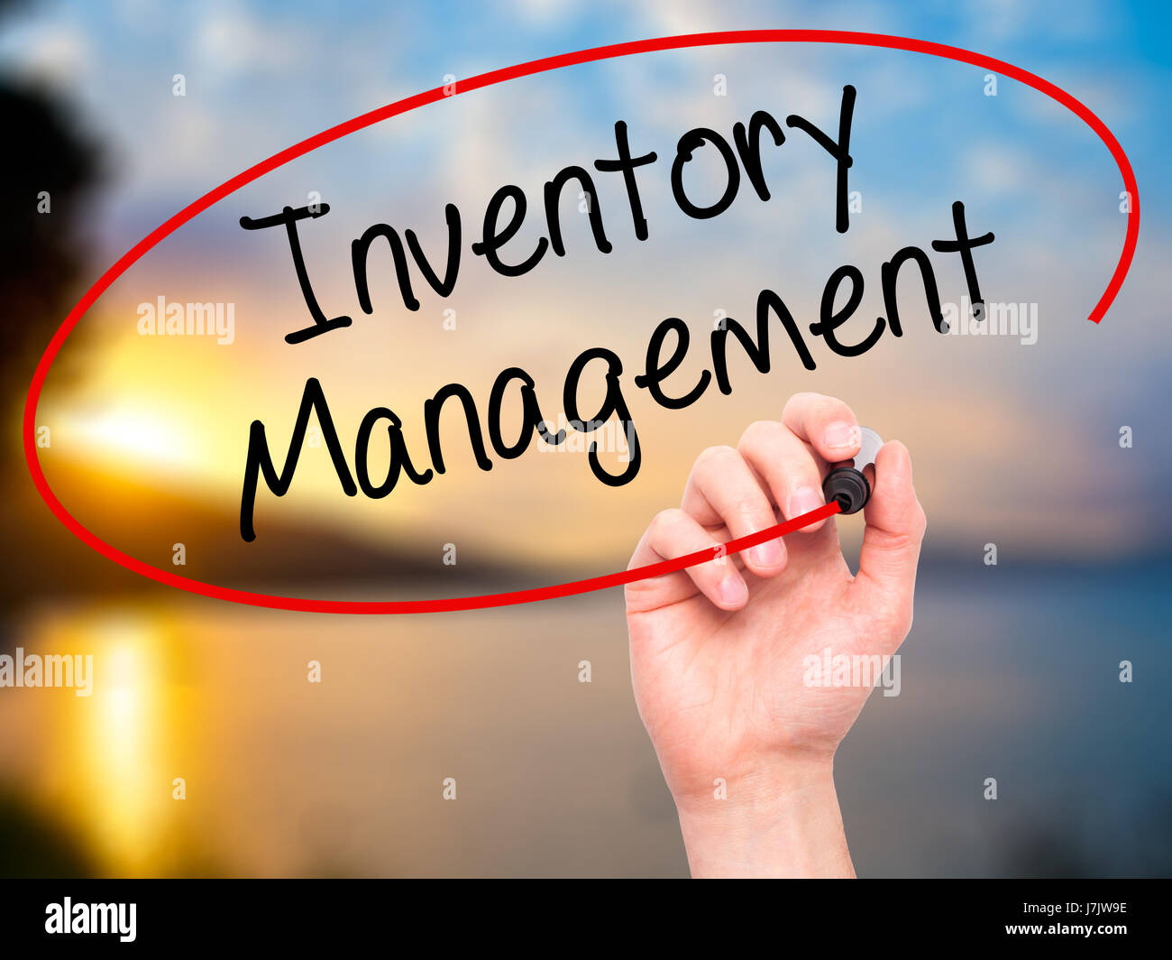 Man Hand writing Inventory Management with black marker on visual ...
