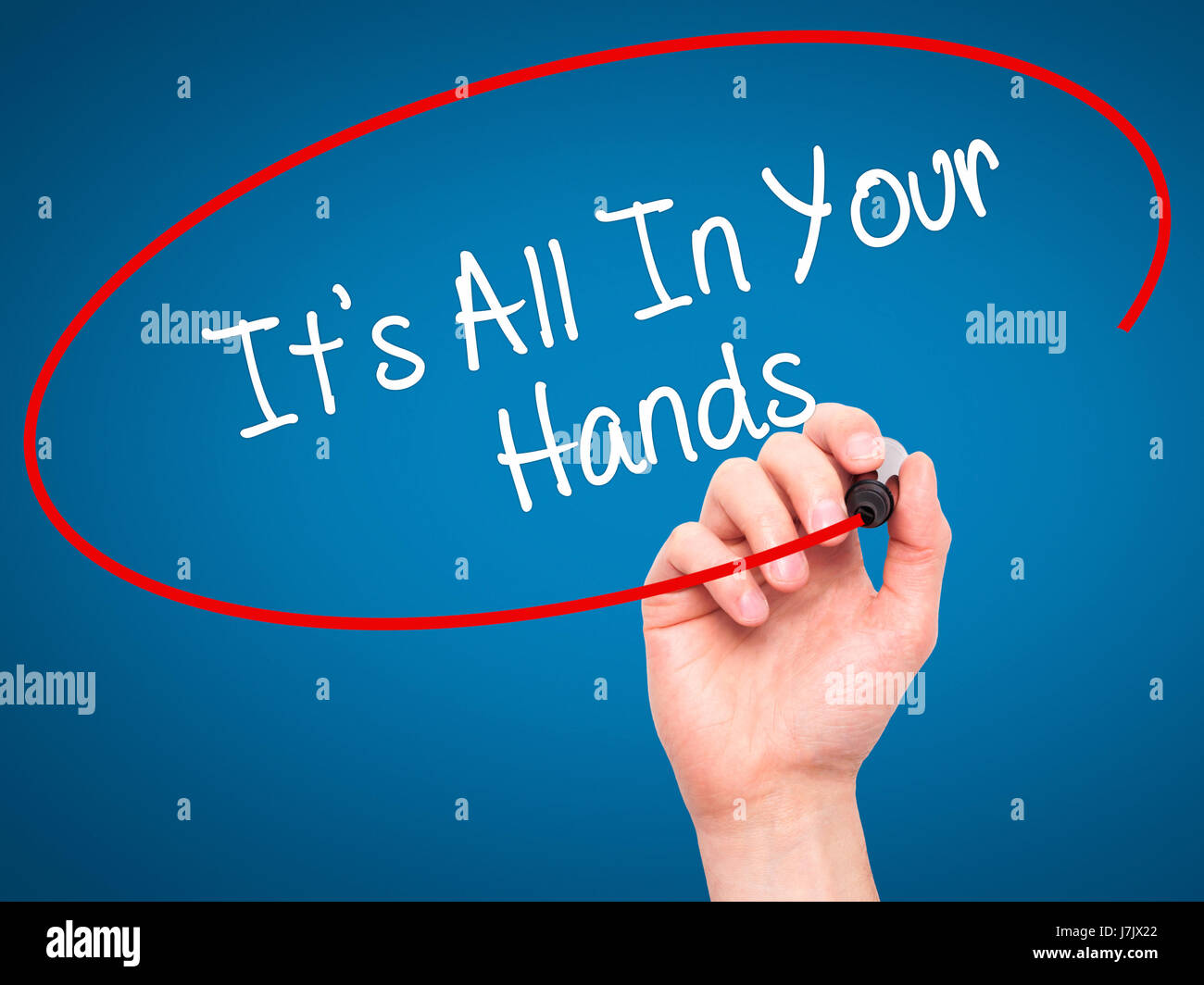 Man Hand writing It's All In Your Hands with black marker on visual ...
