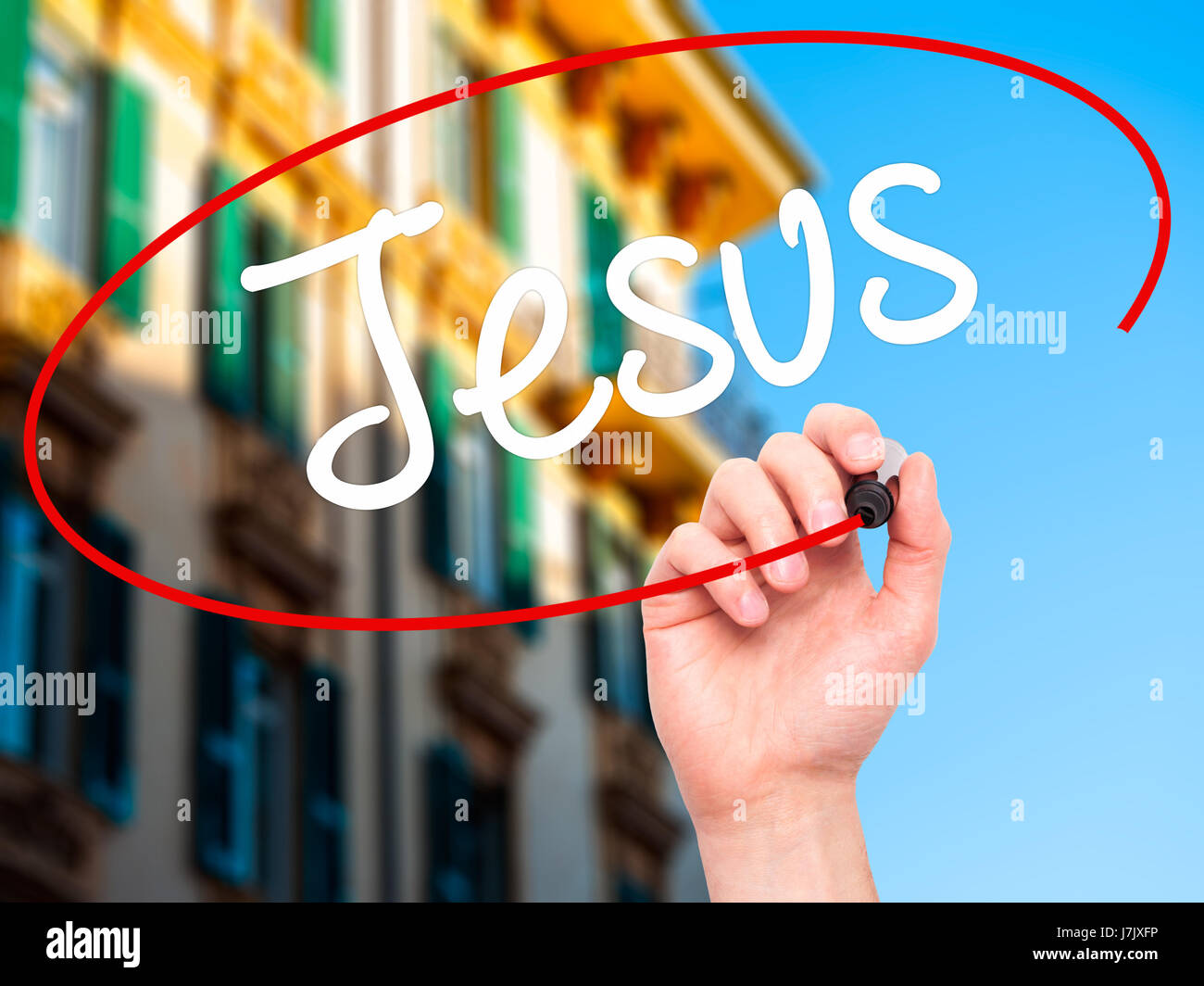 Man Hand writing Jesus with black marker on visual screen. Isolated on ...