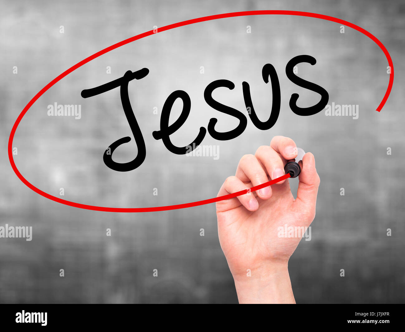 Man Hand writing Jesus with black marker on visual screen. Isolated on ...