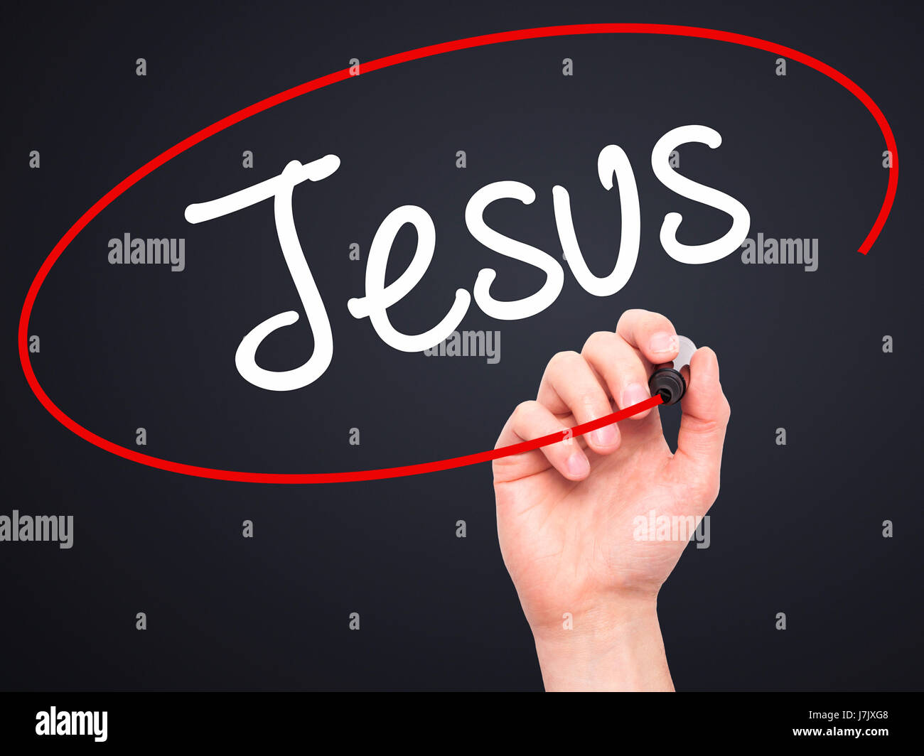 Man Hand writing Jesus with black marker on visual screen. Isolated on ...