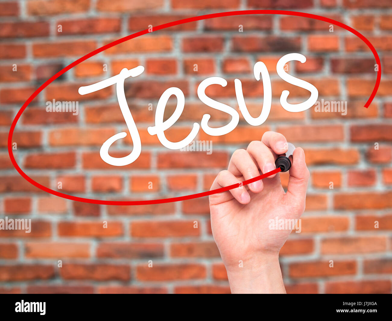 Man Hand writing Jesus with black marker on visual screen. Isolated on ...