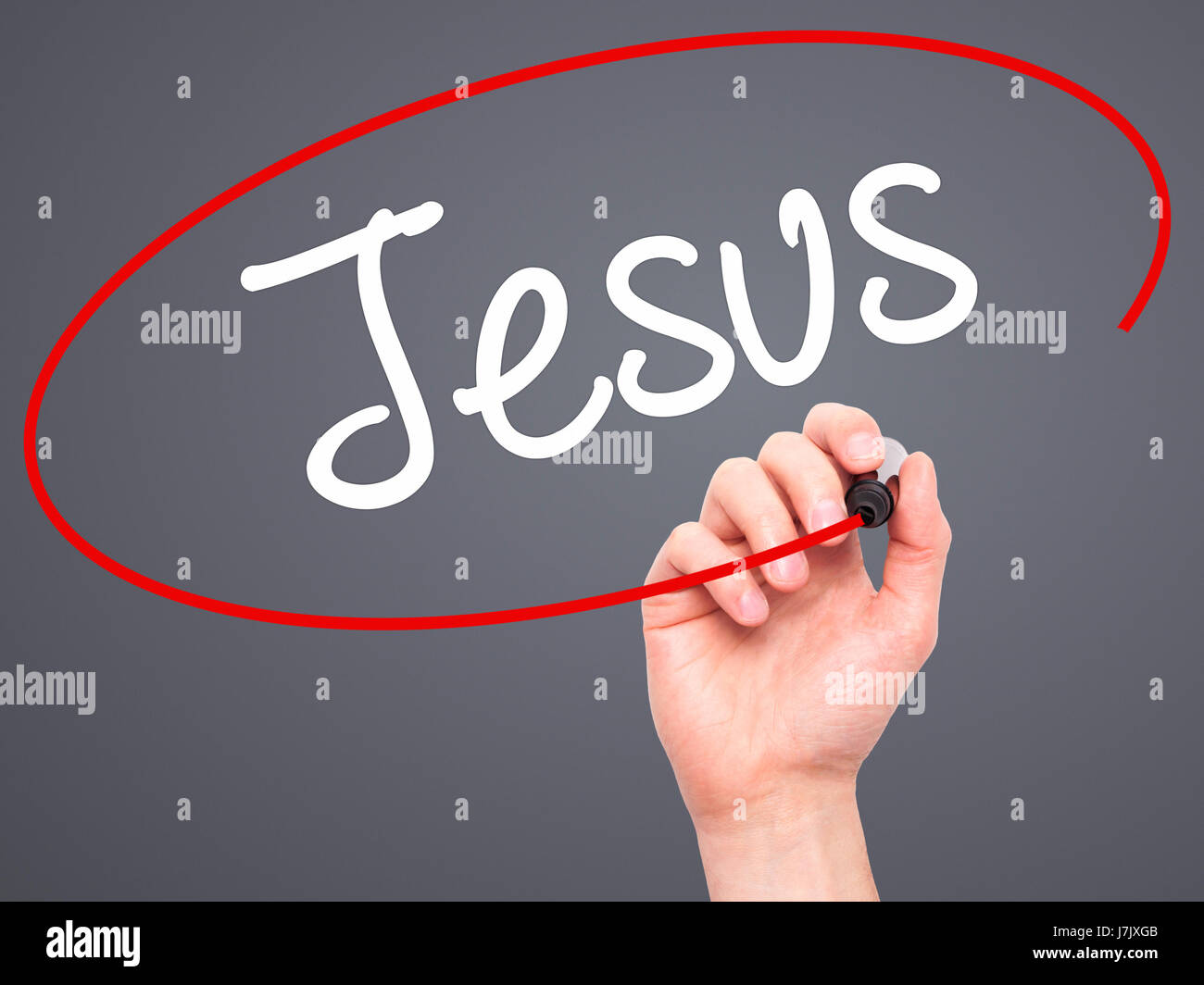 Man Hand writing Jesus with black marker on visual screen. Isolated on ...