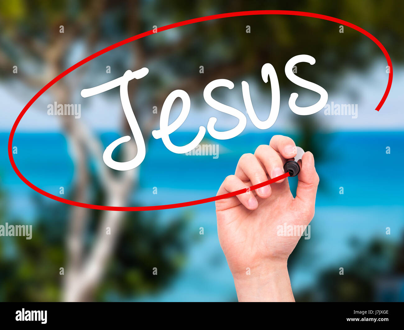 Man Hand writing Jesus with black marker on visual screen. Isolated on ...
