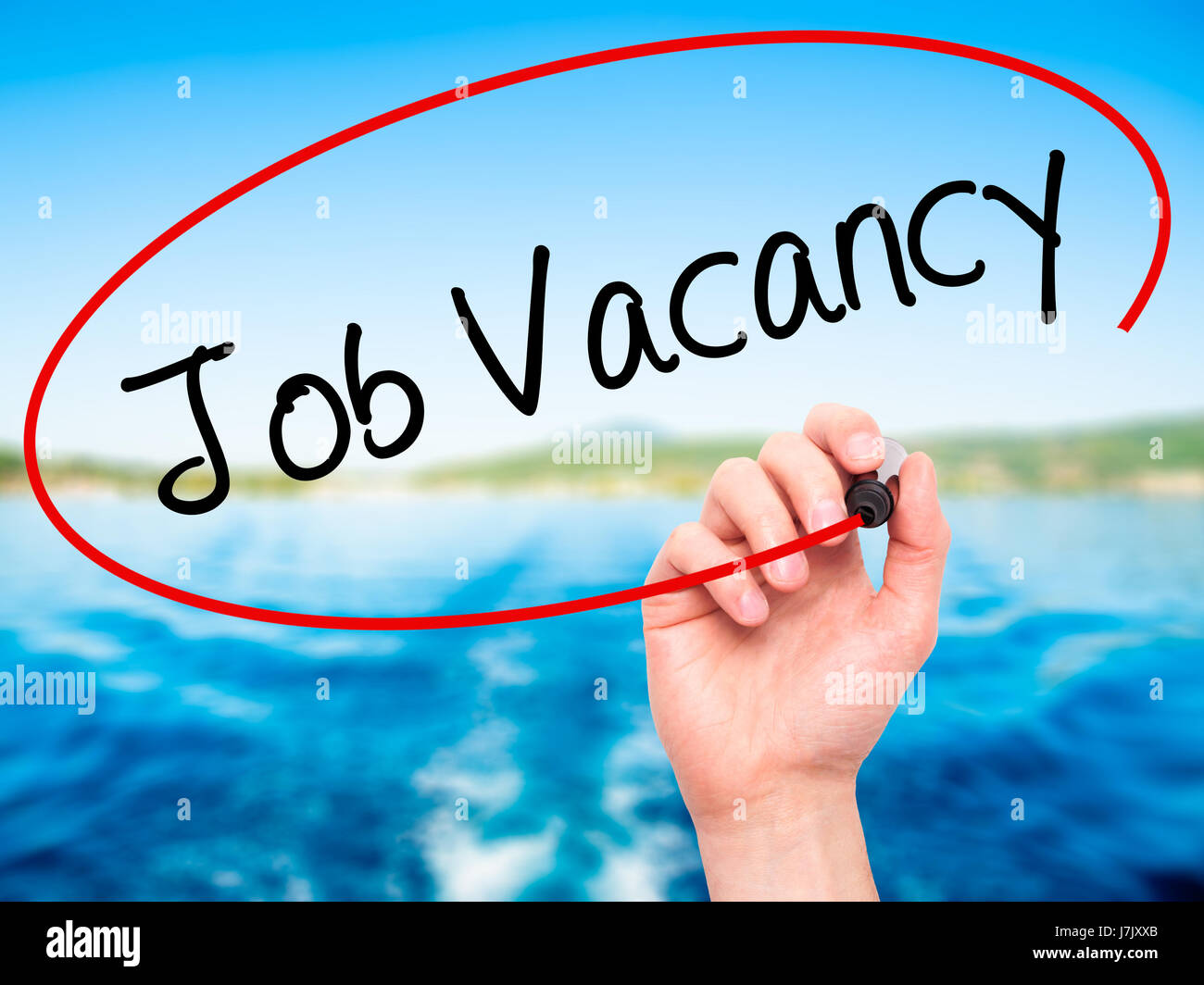 Man Hand writing Job Vacancy with black marker on visual screen ...