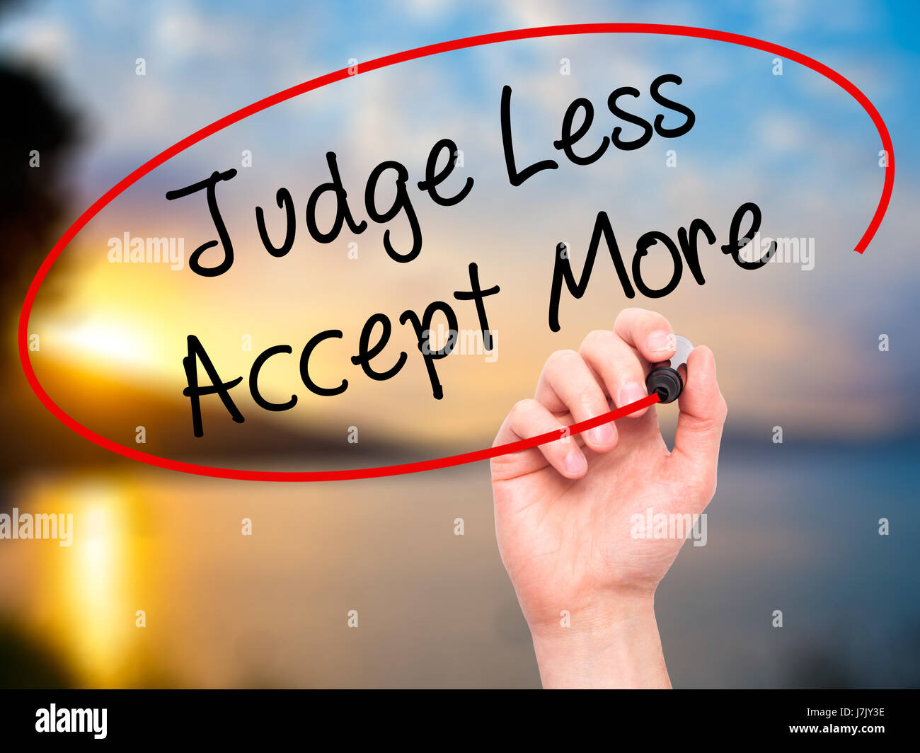 Man Hand writing Judge Less Accept More with black marker on visual ...