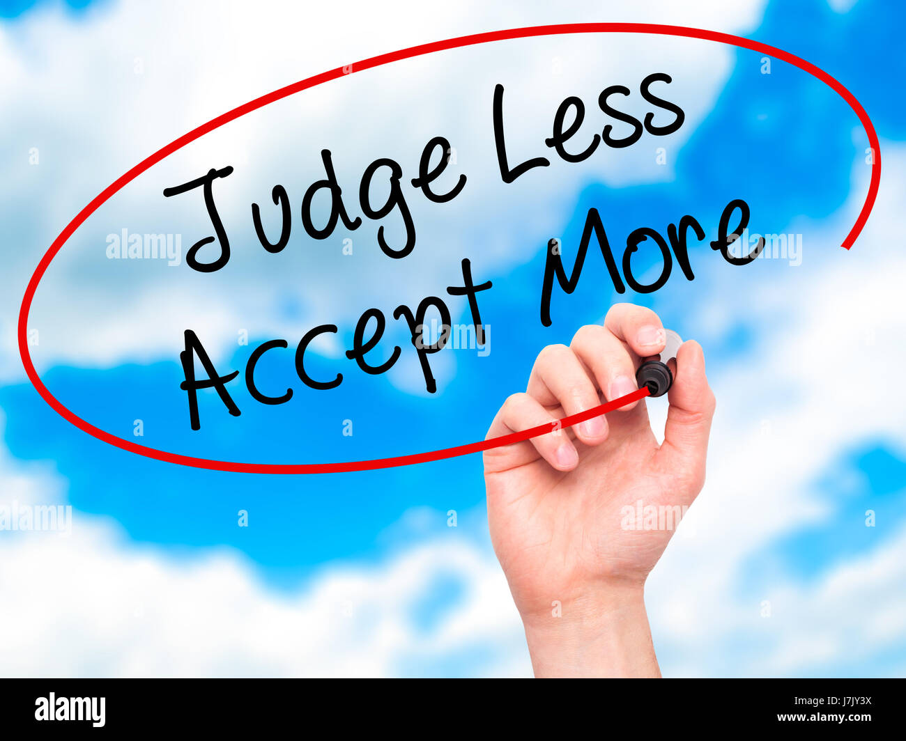 Man Hand writing Judge Less Accept More with black marker on visual ...