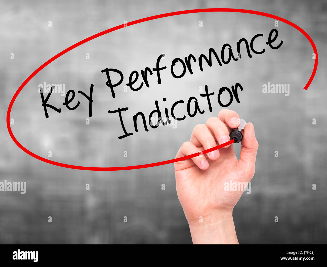 Man Hand writing Key Performance Indicator with black marker on visual ...