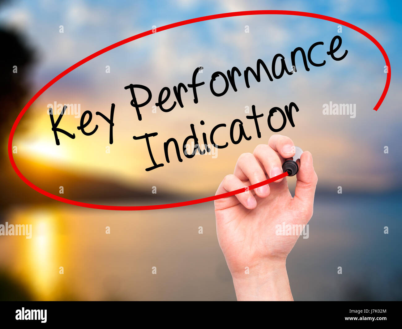 Man Hand writing Key Performance Indicator with black marker on visual ...