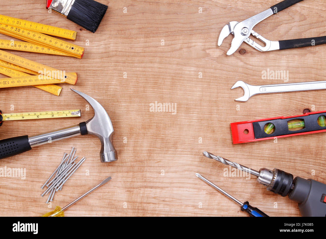 Assorted work tools on wood Stock Photo - Alamy