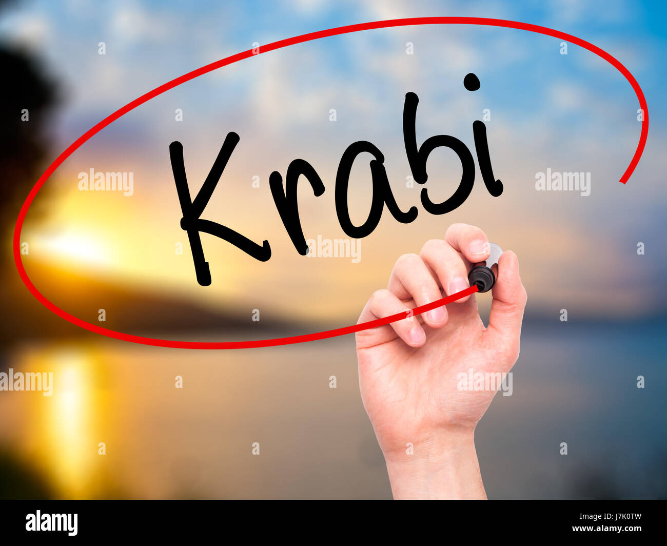 Man Hand writing Krabi with black marker on visual screen. Isolated on ...