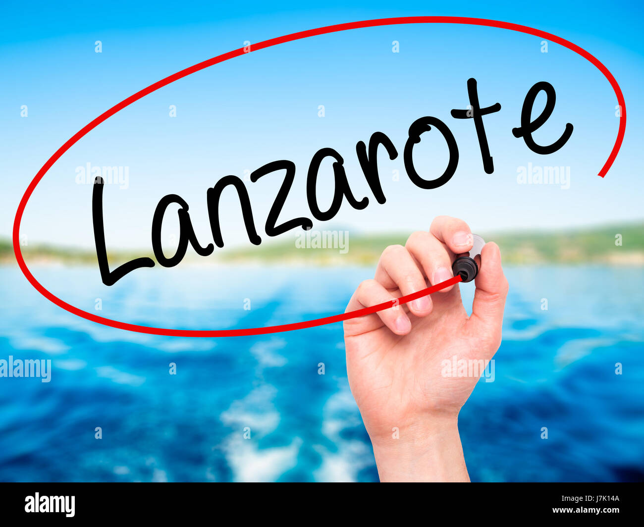 Man Hand writing Lanzarote with black marker on visual screen. Isolated ...
