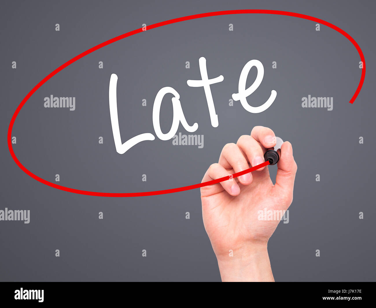 Man Hand writing Late with black marker on visual screen. Isolated on ...