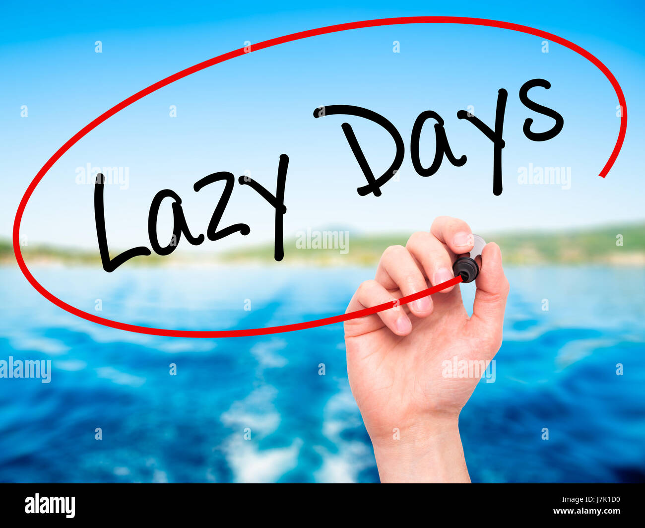 Man Hand writing Lazy Days with black marker on visual screen. Isolated ...