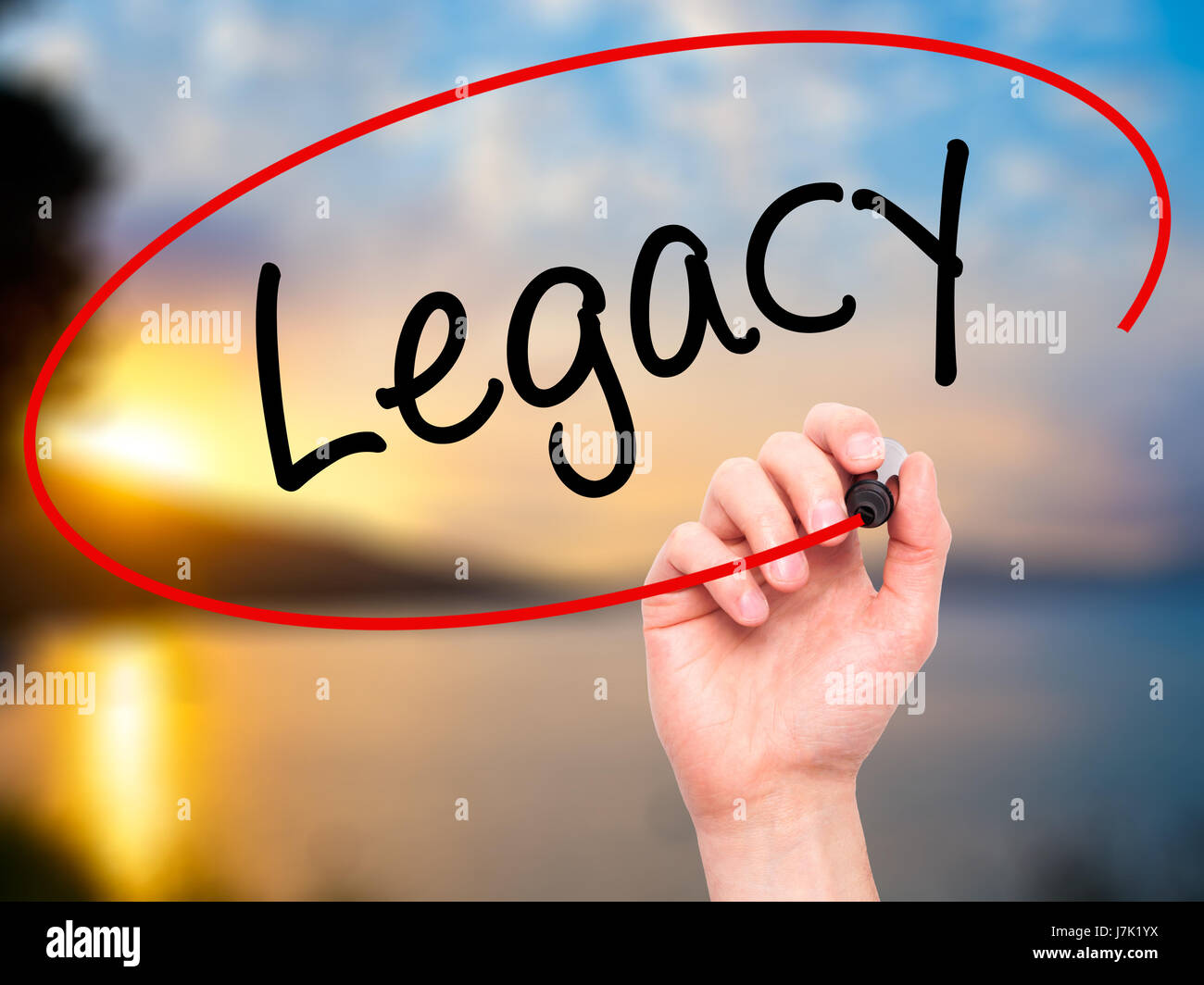 Man Hand writing Legacy with black marker on visual screen. Isolated on ...