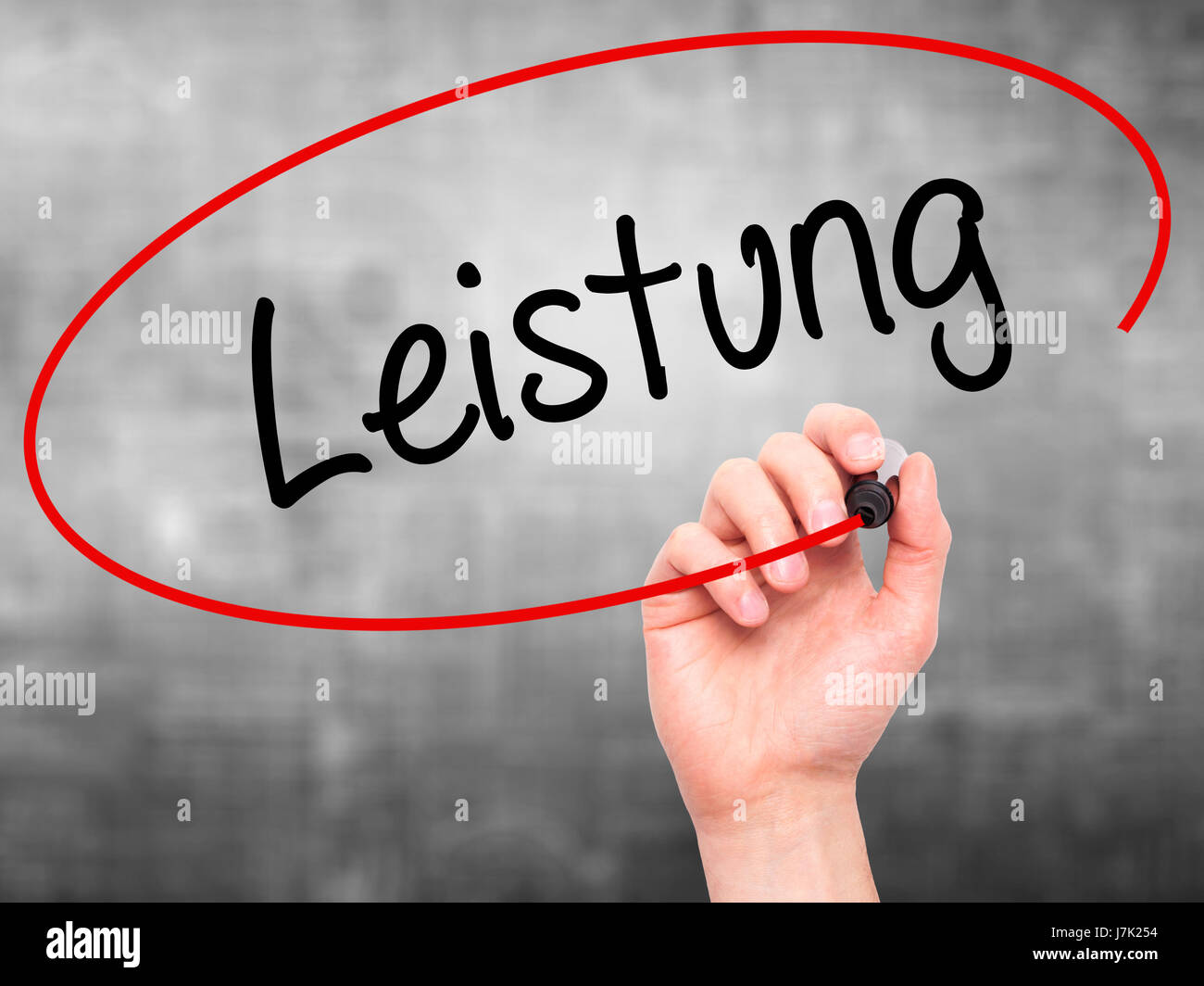 Man Hand writing Leistung (Power in German) with black marker on visual ...