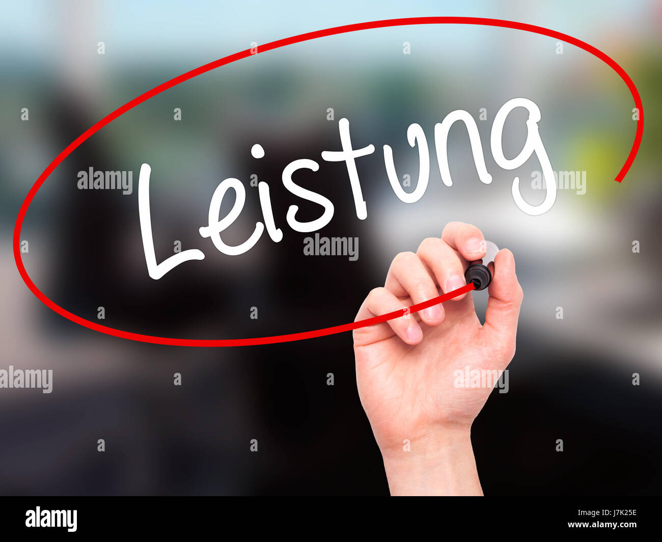 Man Hand writing Leistung (Power in German) with black marker on visual ...