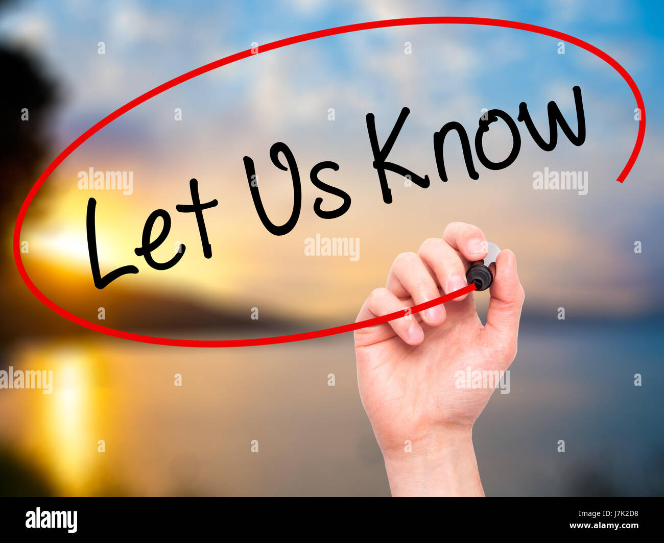 Man Hand writing Let Us Know with black marker on visual screen ...