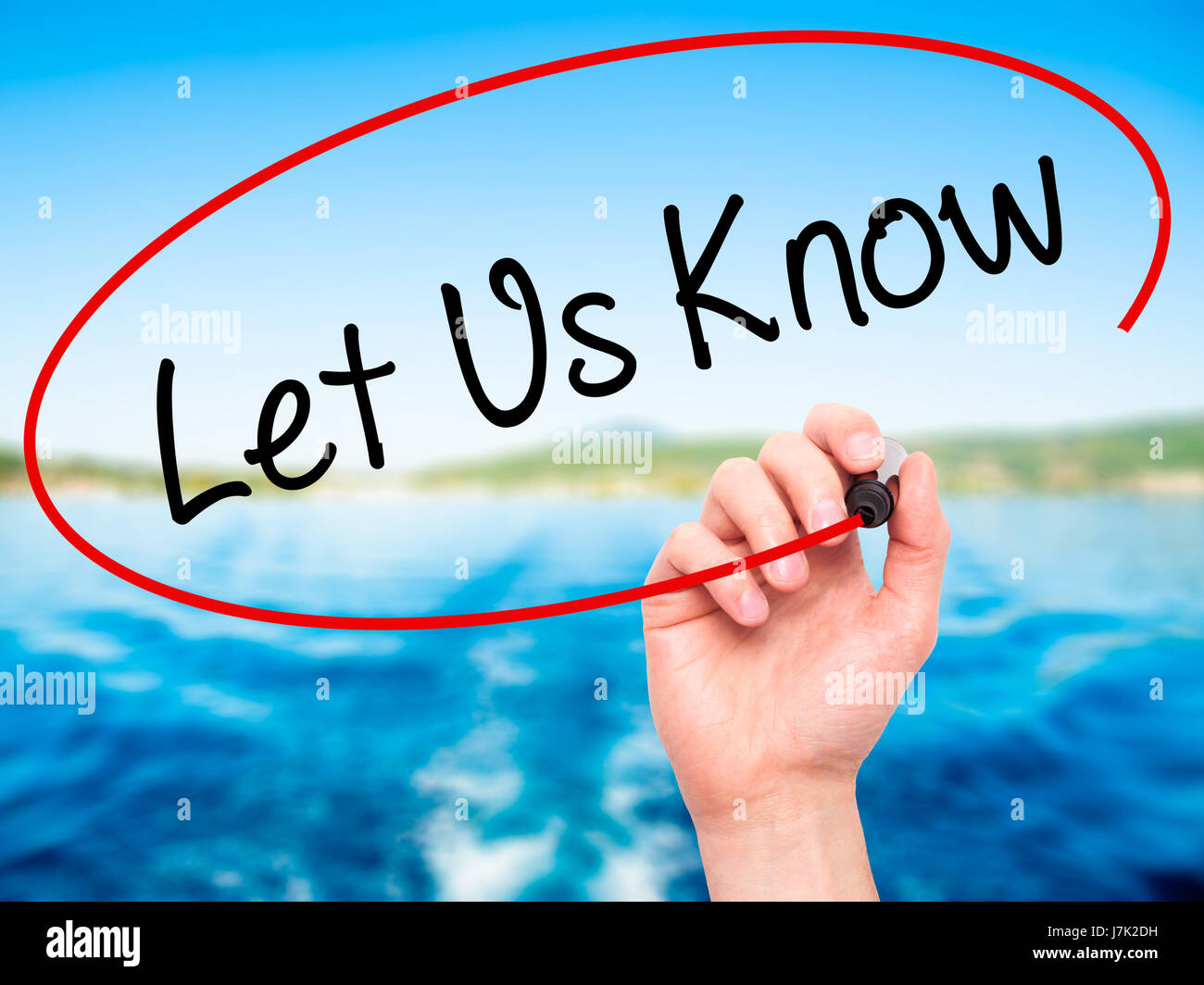 Man Hand writing Let Us Know with black marker on visual screen ...