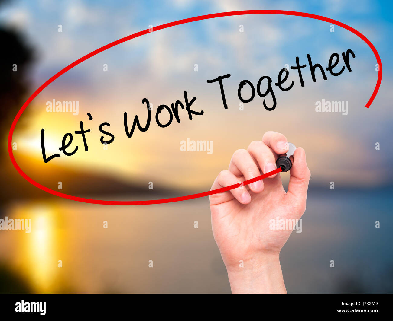 Man Hand writing Lets Work Together with black marker on visual screen ...