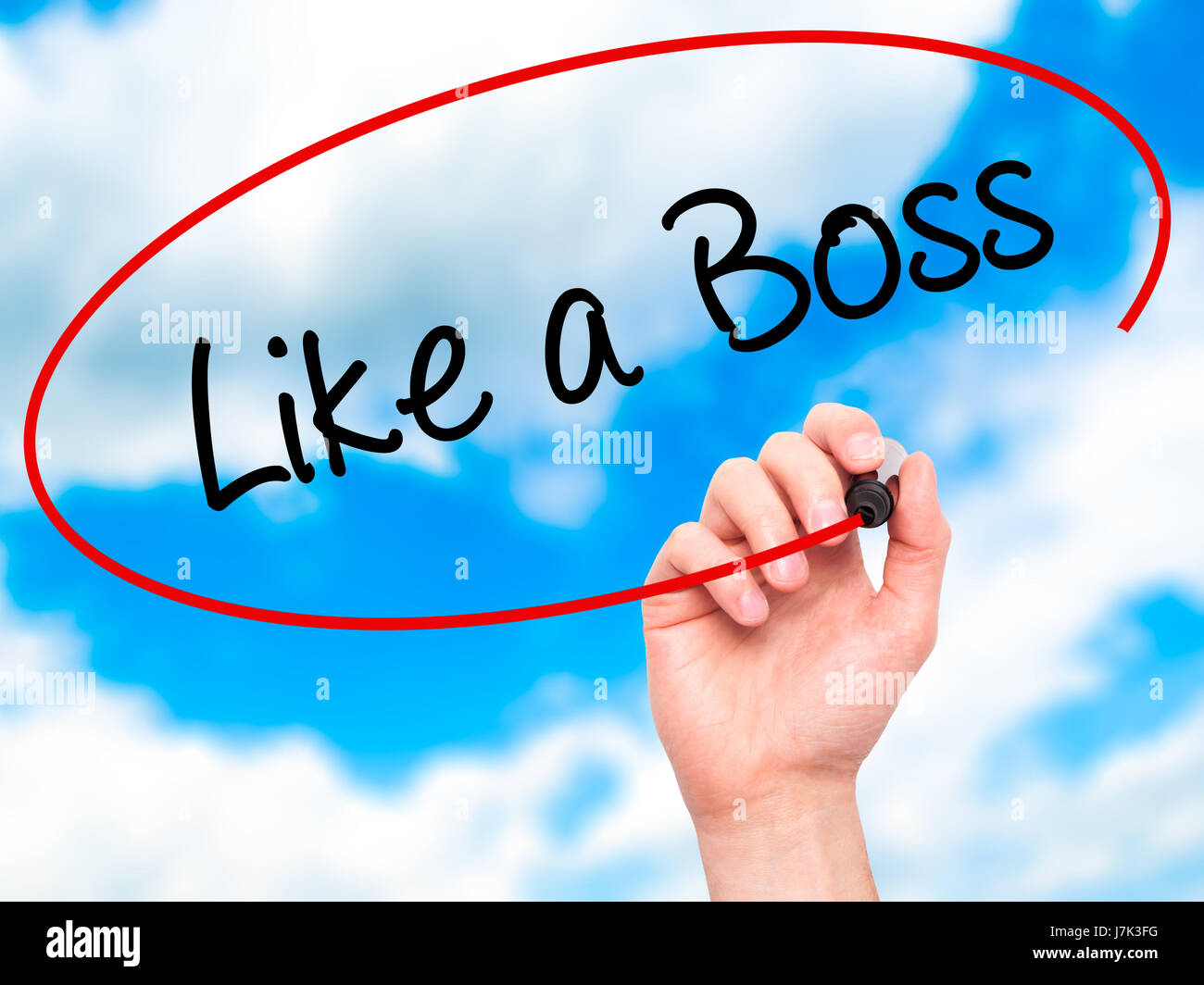 Man Hand writing Like a Boss with black marker on visual screen ...