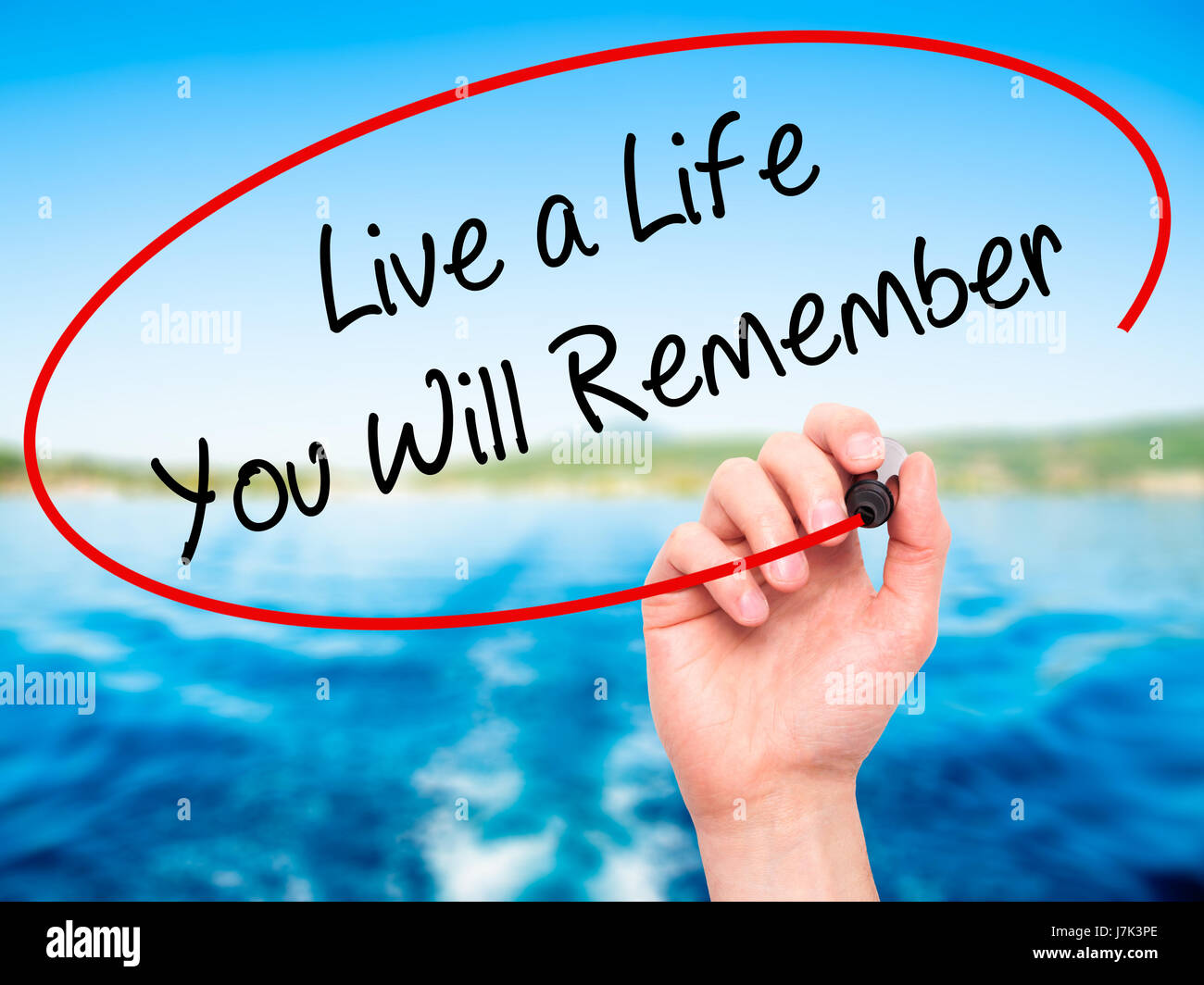 Man Hand writing Live a Life You Will Remember with black marker on ...