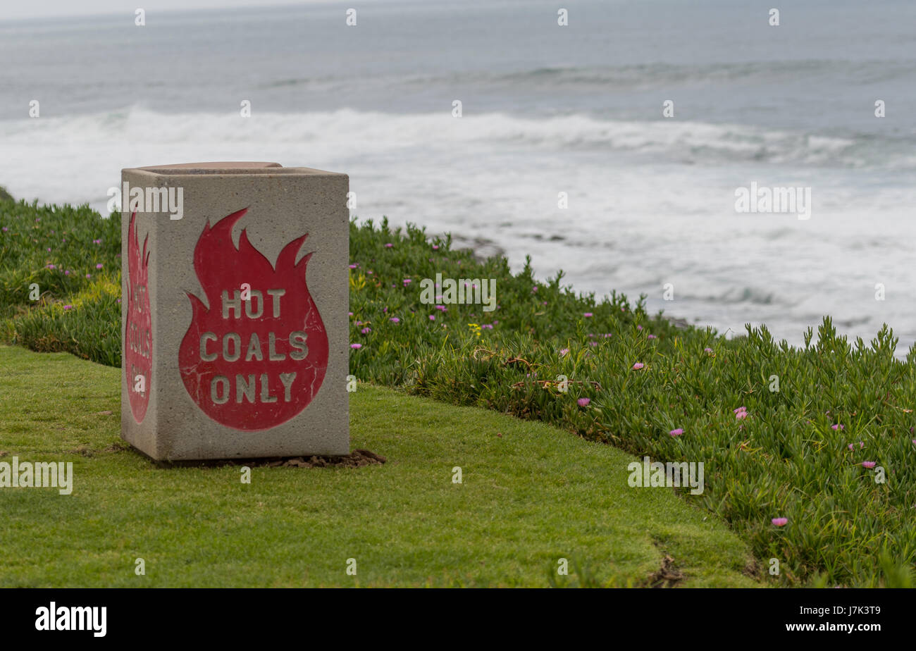 Hot Coals Only Bin on Green Cliff in public park Stock Photo - Alamy