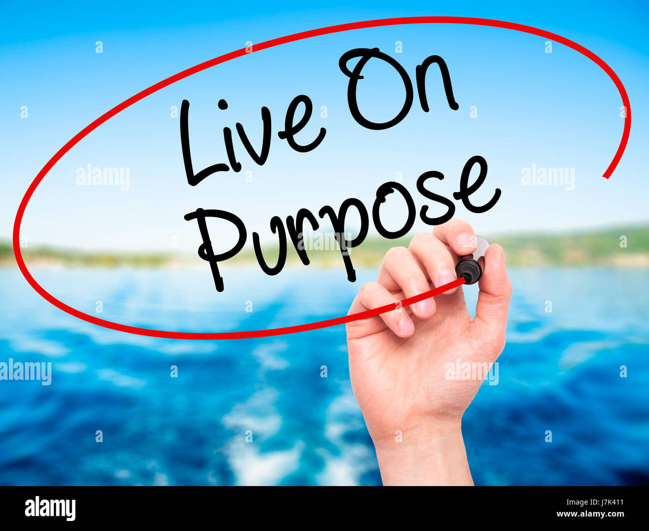 Man Hand writing Live On Purpose with black marker on visual screen ...