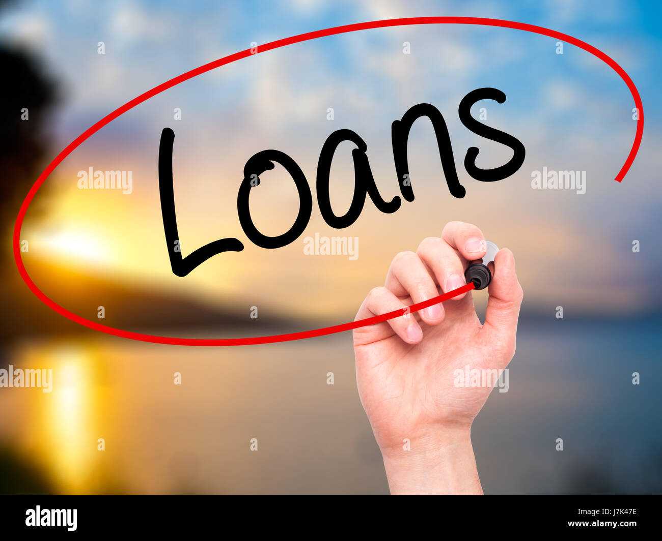Man Hand writing Loans with black marker on visual screen. Isolated on ...