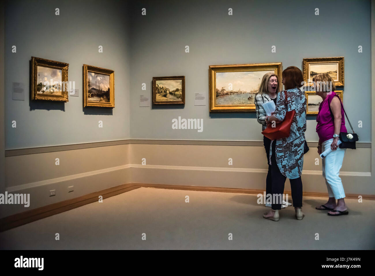 Museum exhibition and art lovers viewing paintings, sculpture Stock ...