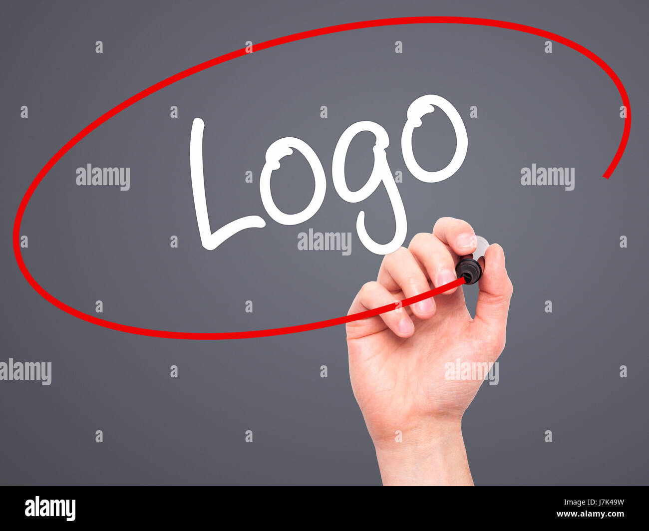 Man Hand writing Logo with black marker on visual screen. Isolated on ...