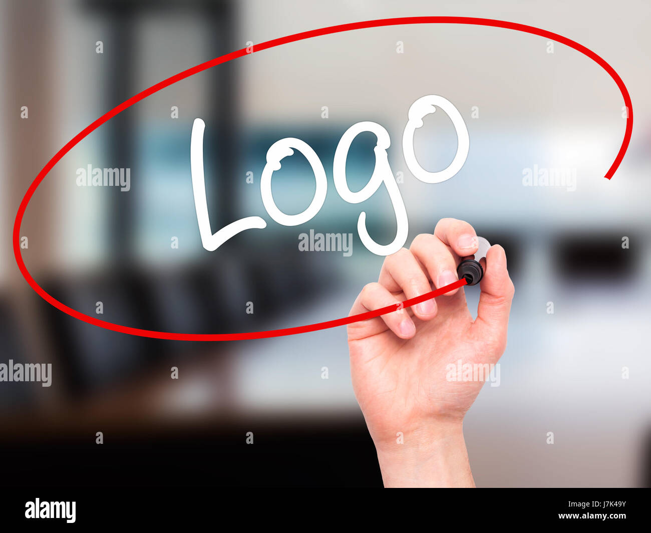 Man Hand writing Logo with black marker on visual screen. Isolated on ...