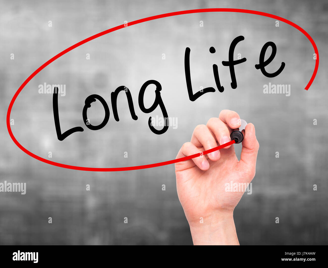 Man Hand writing Long Life with black marker on visual screen. Isolated ...