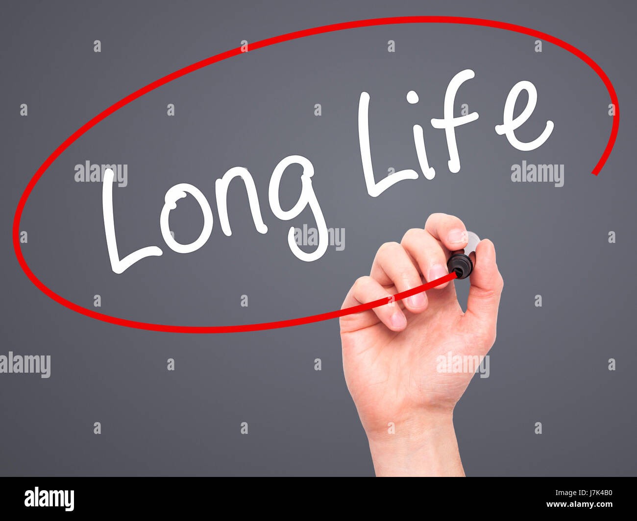 Man Hand writing Long Life with black marker on visual screen. Isolated ...