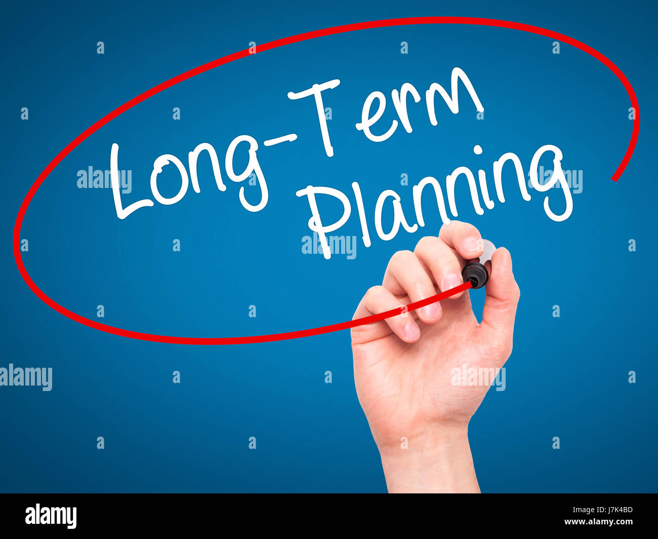 Man Hand writing Long-Term Planning with black marker on visual screen ...