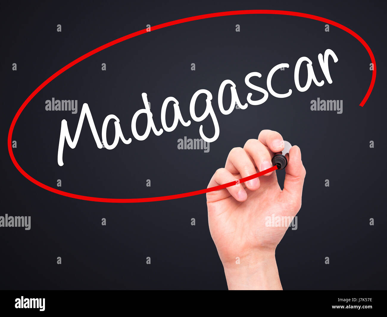 Man Hand writing Madagascar with black marker on visual screen ...
