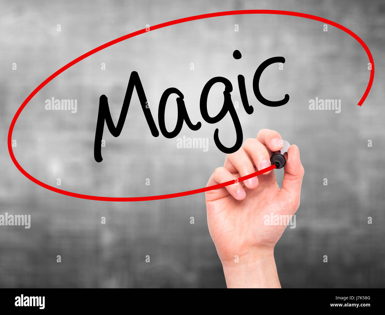 Man Hand writing Magic with black marker on visual screen. Isolated on ...