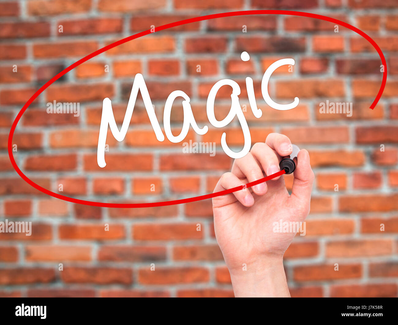 Man Hand writing Magic with black marker on visual screen. Isolated on ...
