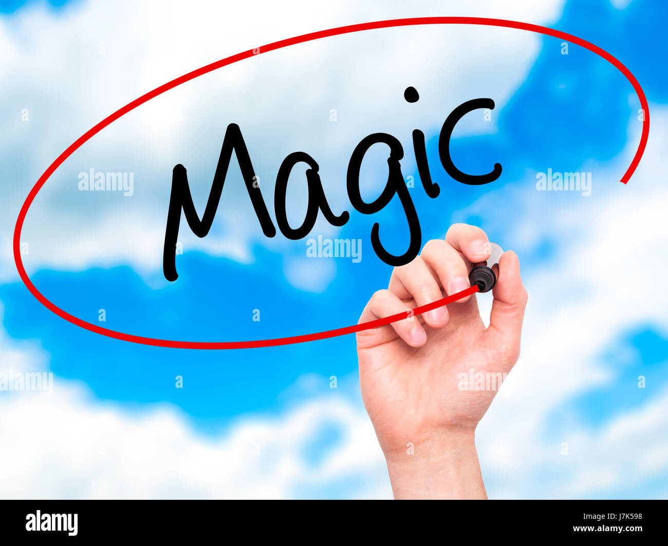 Man Hand writing Magic with black marker on visual screen. Isolated on ...
