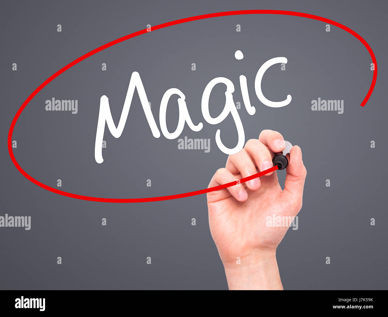 Man Hand writing Magic with black marker on visual screen. Isolated on ...