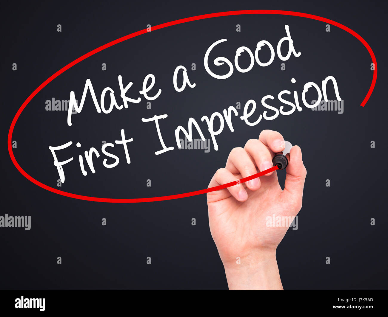 Man Hand writing Make a Good First Impression with black marker on ...