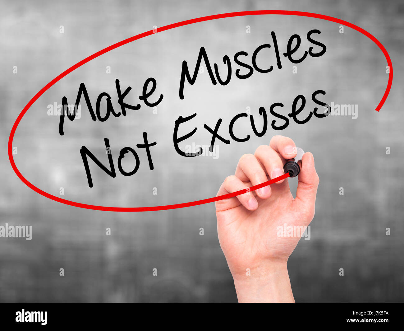 Man Hand writing Make Muscles Not Excuses with black marker on visual ...